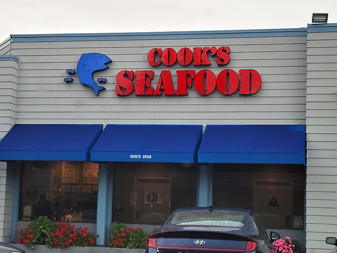 The unassuming blue-awninged exterior of Cook's Seafood stands as a beacon to seafood lovers, proving that culinary treasures often hide in plain sight.