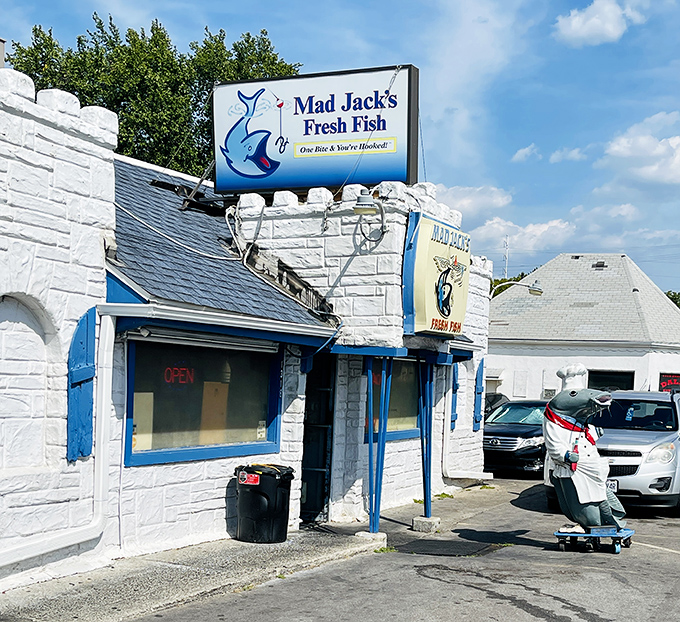 The castle-like exterior of Mad Jack's Fresh Fish stands as a blue-trimmed beacon of seafood hope in landlocked Kansas City.