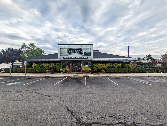 The exterior of Central Diner & Grille stands like a beacon of comfort food promise under Pittsburgh skies. Some buildings just look like they contain happiness.