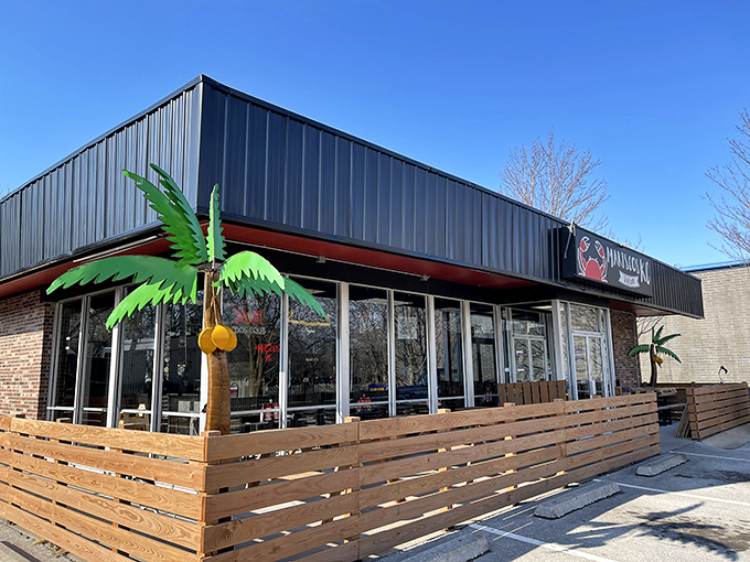 Palm trees in Kansas? This cheerful exterior brings coastal vibes to the heartland, complete with wooden patio seating for sunny day seafood indulgence.