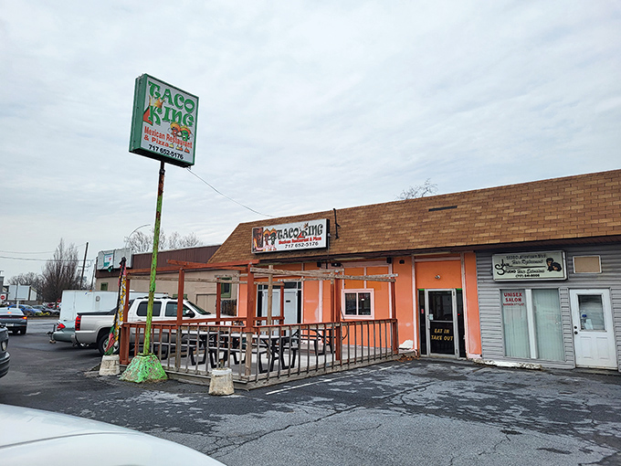 The bright orange exterior of Taco King stands like a beacon of culinary promise on Allentown Boulevard. Your taste buds' happy place awaits! 