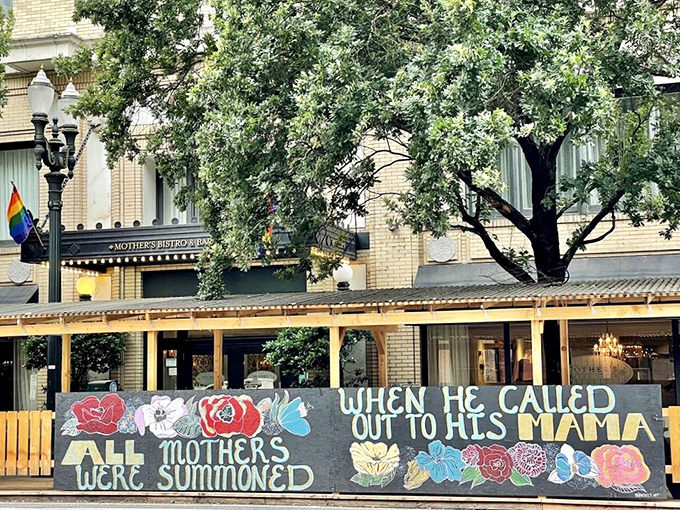 The corner storefront beckons like an old friend, promising comfort with its elegant awning and warm glow from within. Portland's downtown treasure awaits
