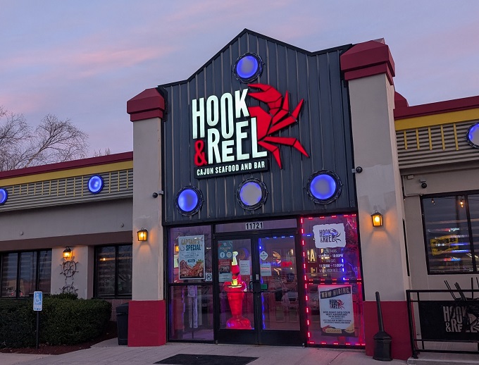 The nautical-themed exterior of Hook & Reel stands like a lighthouse for seafood lovers in landlocked Kansas, complete with those charming porthole windows.