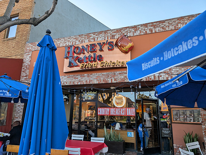 The brick-faced storefront with its iconic sign and blue awning promises what might be California's most perfect fried chicken experience.