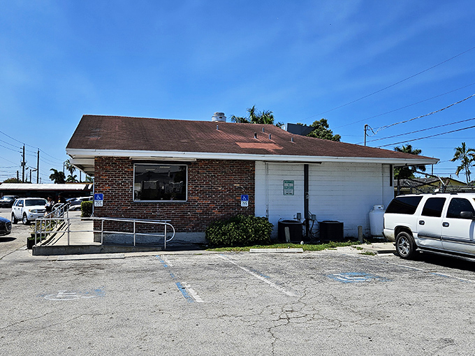 The unassuming brick exterior of Dixie Fried Chicken stands like a temple to simplicity&mdash;proof that culinary greatness doesn't need fancy architecture.