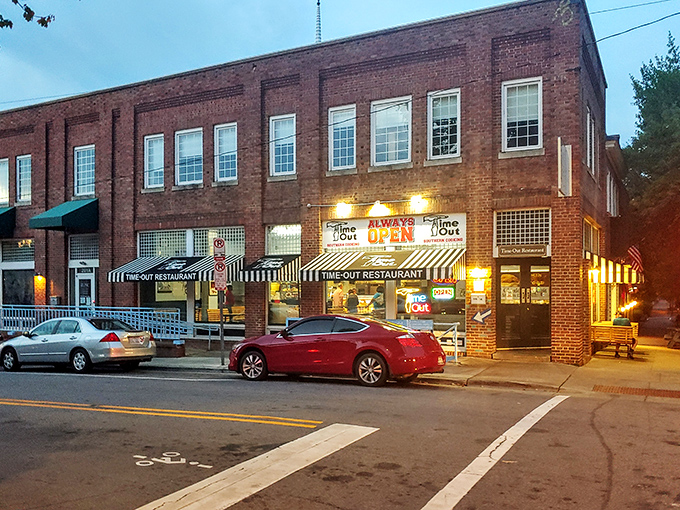 The brick facade of Time-Out beckons hungry visitors with its iconic striped awning and neon signs&mdash;a 24/7 beacon of Southern comfort on Franklin Street.