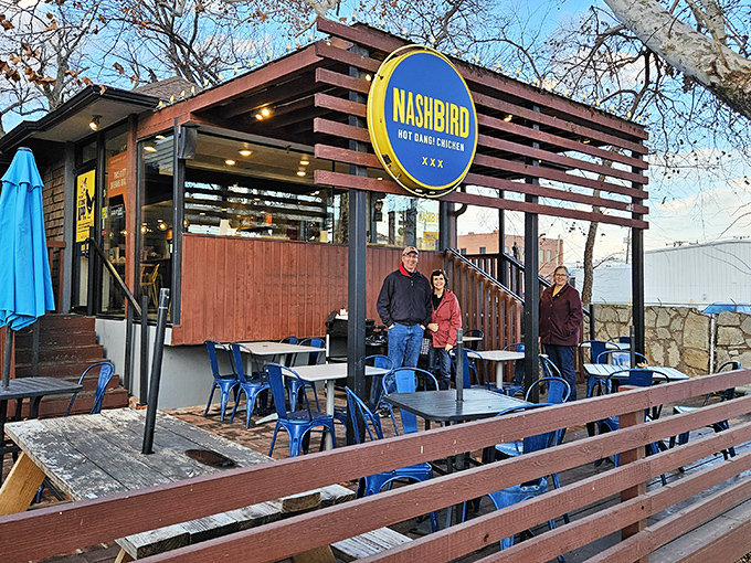 Nashbird's rustic wooden exterior isn't just Instagram-worthy&mdash;it's a siren call to chicken lovers everywhere. The circular yellow sign promises delicious things await.