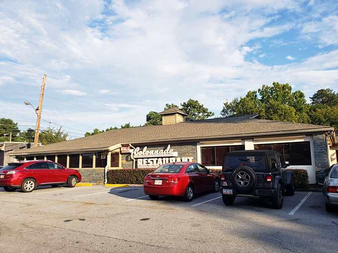 The unassuming exterior of The Colonnade has been beckoning Atlanta's hungry souls for decades, proving that culinary treasures don't always hide behind flashy facades.