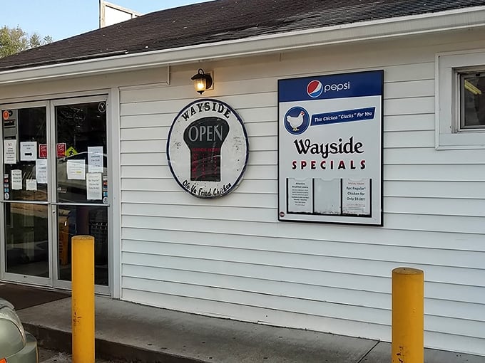 The unassuming white building with its iconic sign promises "Ole' Virginia Fried Chicken" &ndash; a beacon of hope for hungry travelers seeking authentic Southern comfort. 