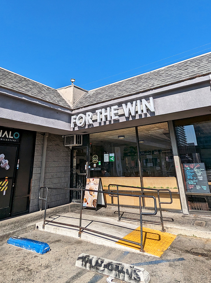 The unassuming strip mall exterior of For The Win proves once again that culinary treasures often hide in the most ordinary-looking places.