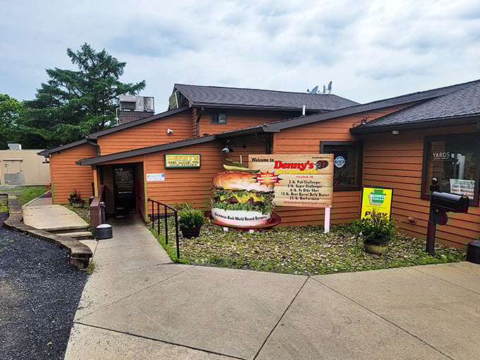 The unassuming wooden exterior of Denny's Beer Barrel Pub hides a temple of burger excess that would make Paul Bunyan do a double-take.