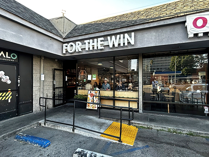 The unassuming strip mall exterior of For The Win proves once again that culinary treasures often hide in the most ordinary-looking places.