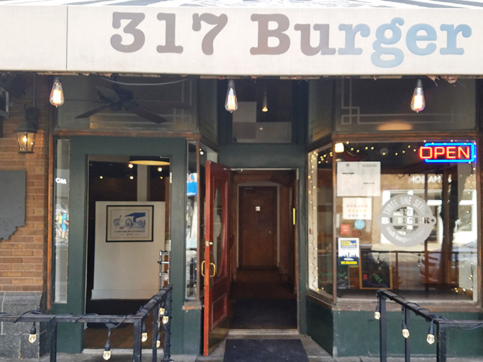 The unassuming storefront of 317 Burger might not stop traffic, but the aroma wafting from inside should require a special permit.