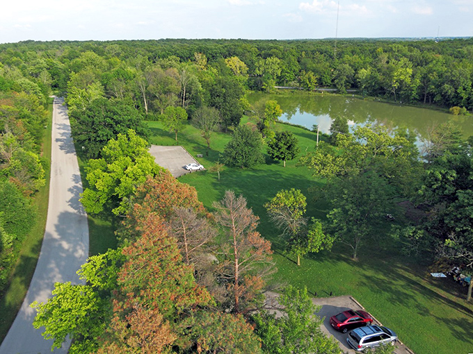 A bird's-eye view of paradise! Ouabache State Park unfolds like nature's own patchwork quilt, with lush forests, winding roads, and a shimmering lake.