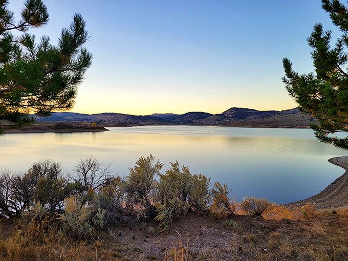 Mirror, mirror on the lake! Unity Lake's glassy surface reflects the sky like nature's own Instagram filter.