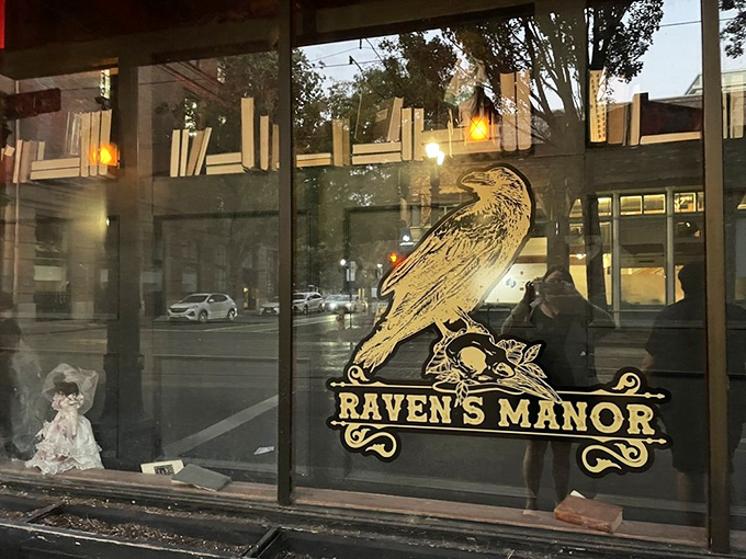 The golden raven beckons from the window, while a creepy doll lurks in the corner. Edgar Allan Poe would approve of this haunting entrance. 