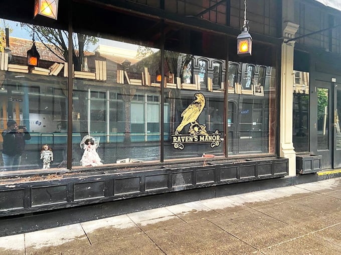 The golden raven beckons from the window, while a creepy doll lurks in the corner. Edgar Allan Poe would approve of this haunting entrance. 