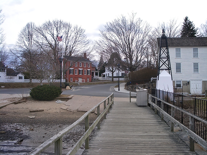 A quintessential New England scene where history meets waterfront charm. Essex's colonial buildings stand proudly against bare winter trees, inviting spring visitors to explore.