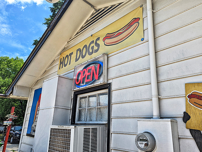 Don't judge a dog by its doghouse! This unassuming white building with its cheerful red door houses hot dog magic that draws devotees from miles around.