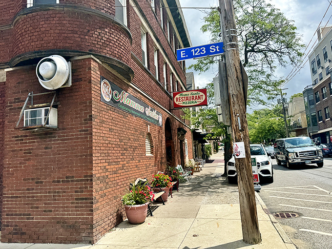 The unassuming brick corner that houses pizza paradise. Like Clark Kent's glasses, this modest exterior hides superhero-level Italian food inside. 