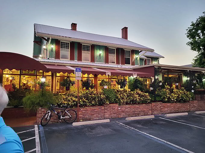 The green building with cherry-red awnings stands like a time capsule of comfort food dreams. Florida's culinary equivalent of finding a $20 bill in your winter coat.