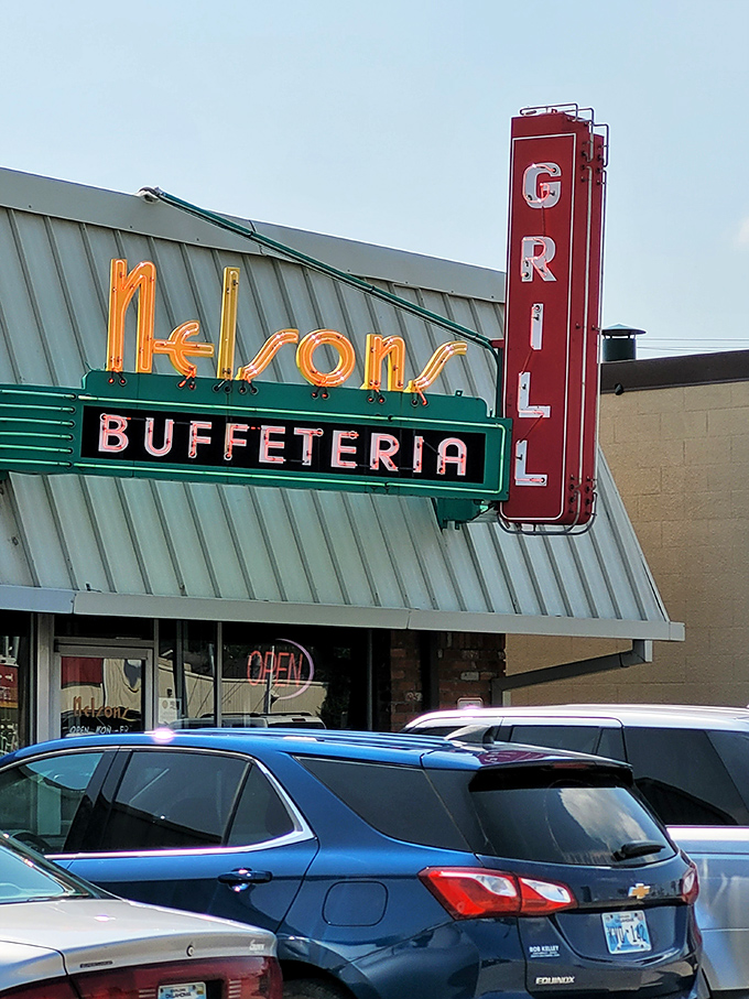 The neon sign at Nelson's Buffeteria glows like a beacon of hope for hungry travelers. This retro masterpiece promises comfort food salvation ahead.