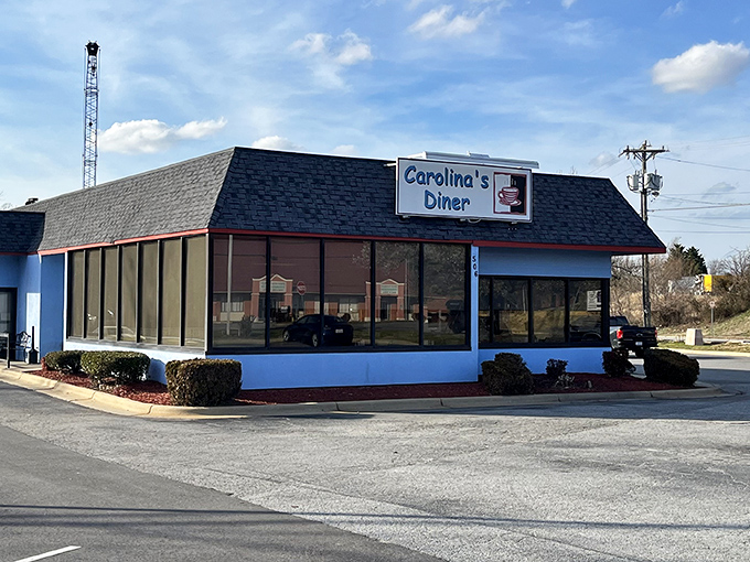 The distinctive blue exterior of Carolina's Diner stands as a beacon of breakfast hope along Regional Road, promising comfort food salvation inside.