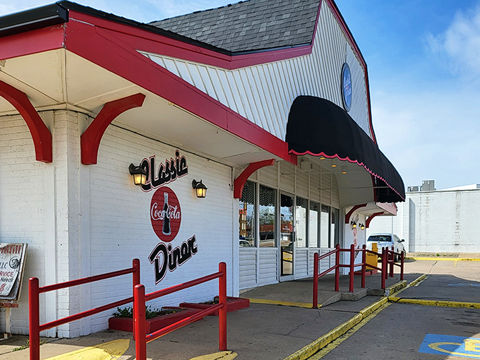 The red and white exterior of Classic Diner stands like a time capsule on Henryetta's landscape, beckoning hungry travelers with its vintage charm and glowing "OPEN" sign.