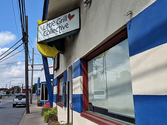 The unassuming blue-striped exterior of The Little Grill Collective hides culinary treasures that locals have cherished for decades.