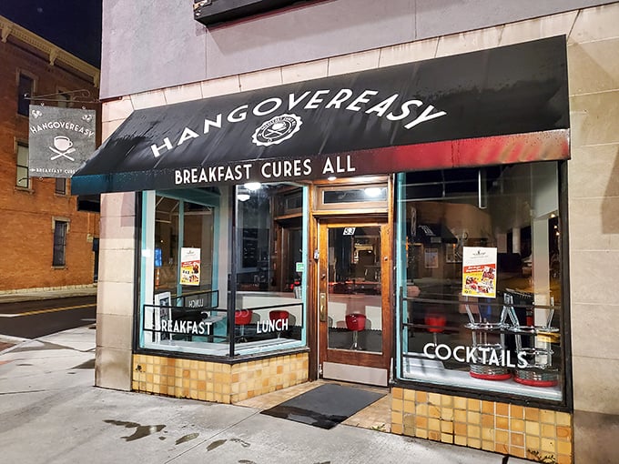 The black awning says it all: "BREAKFAST CURES ALL." At Hang Over Easy, they're not just making a promise—they're offering salvation by spatula.