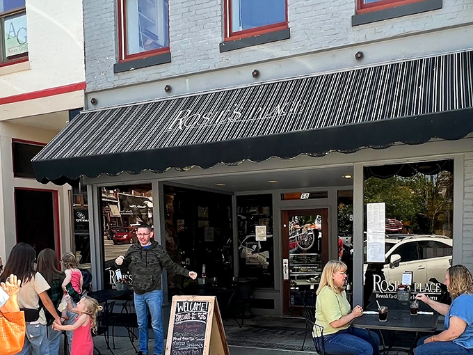 The charming storefront of Rosie's Place beckons with its classic awning and inviting outdoor seating. Downtown Noblesville's breakfast gem awaits.