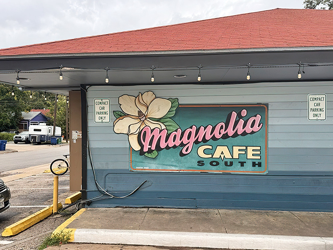 The iconic blue exterior of Magnolia Cafe stands as an Austin landmark, its welcoming porch and signature sign beckoning hungry pilgrims at all hours.