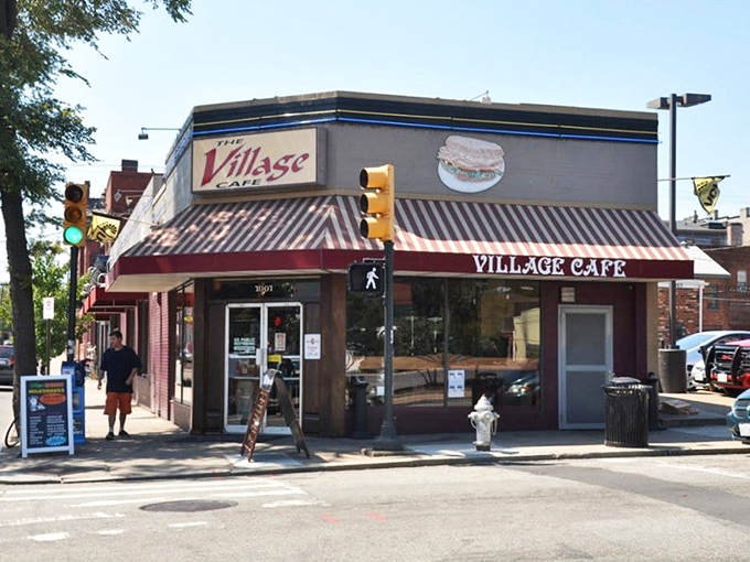 That iconic neon sign beckons like an old friend through the window. Village Cafe's exterior promises authentic diner magic without a hint of pretension.