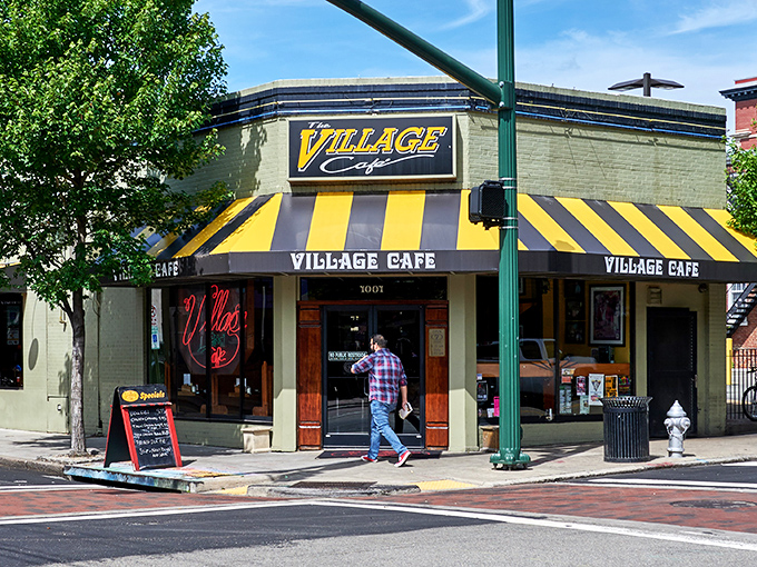 That iconic neon sign beckons like an old friend through the window. Village Cafe's exterior promises authentic diner magic without a hint of pretension.