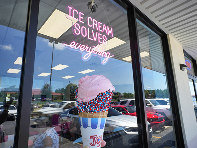 Scoops Homemade Ice Cream stands proudly in Hot Springs, its cheerful yellow facade promising sweet relief from Arkansas summer heat. The "OPEN" sign never looked so inviting.