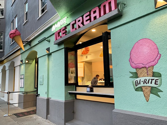 The mint-green facade with its vintage neon sign beckons like a siren song. San Francisco's ice cream pilgrimage site glows invitingly against the evening sky.