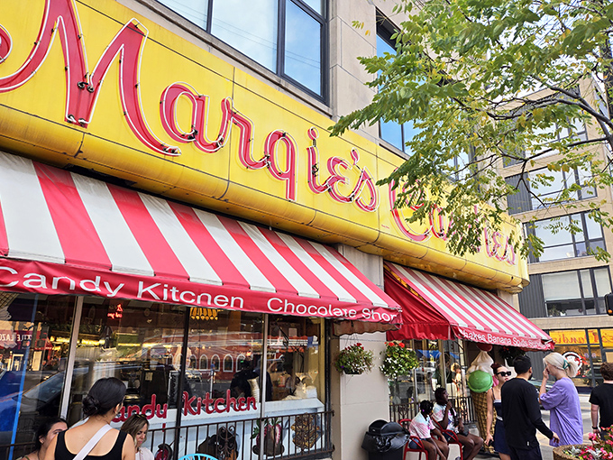 That iconic yellow and red sign beckons like a lighthouse for sweet-toothed sailors navigating the urban seas of Chicago's neighborhoods.