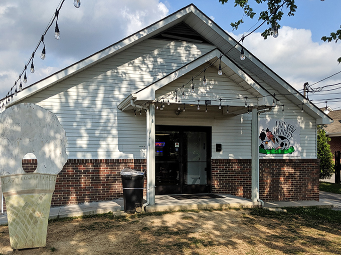 The unassuming white building with string lights and a cow logo promises more joy than most five-star restaurants I've visited.