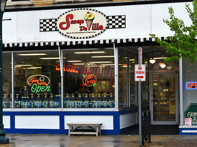 The classic checkered facade of Scoop De Ville stands like a time portal to simpler days when ice cream was the ultimate problem solver. 