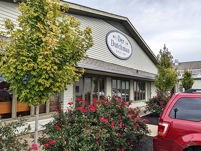 The welcoming facade of Der Dutchman stands like a beacon of comfort food in Plain City, with its charming porch and country-style architecture inviting hungry travelers inside.