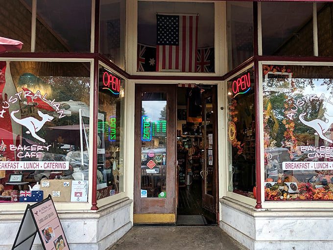 The red awning beckons like a culinary lighthouse on Marietta Square, promising authentic Down Under delights that'll make you forget you're in Georgia.
