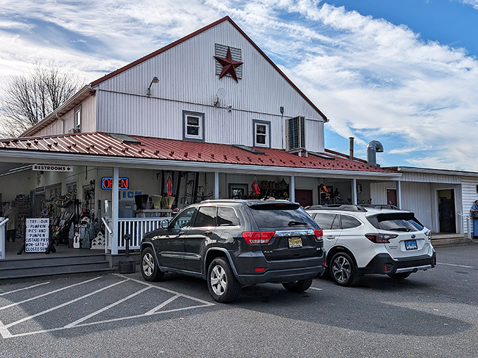 The classic white barn with its distinctive red roof stands as a beacon of baked goodness in Bird in Hand, Pennsylvania's rolling countryside.