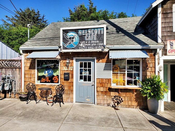 Quaint charm meets culinary magic! This cozy shingle-clad café looks like it was plucked straight from a Norman Rockwell painting, promising comfort food with a side of nostalgia.