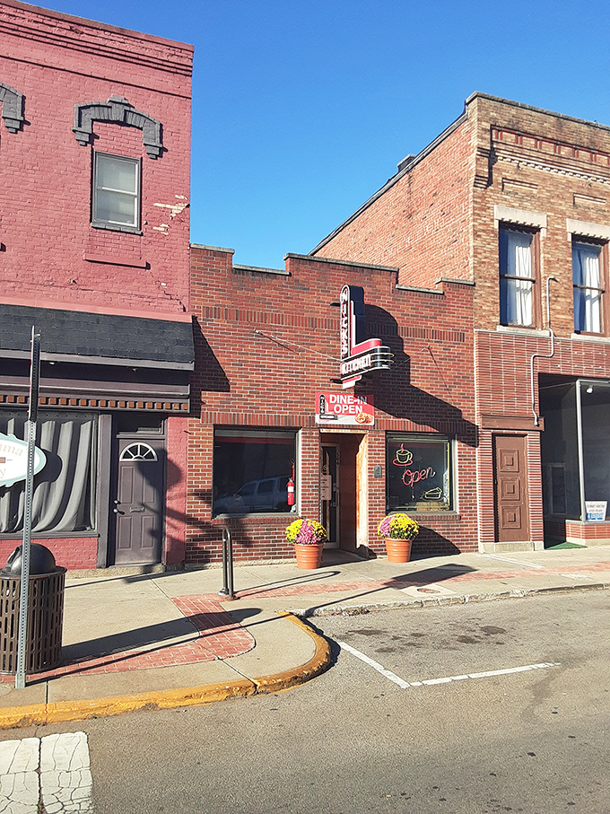 The iconic red brick corner building of Nick's Kitchen stands as a beacon of culinary history on Jefferson Street in downtown Huntington.