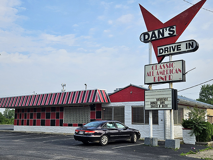 The red and white checkered exterior of Tio's Diner stands as a time capsule of Americana, beckoning hungry travelers with nostalgic charm.