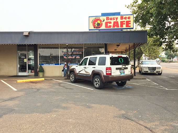 The iconic Busy Bee Caf&eacute; sign stands proud against Oregon's sky, promising comfort food that's worth pulling over for. 
