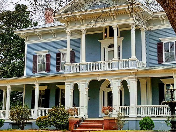 The stately blue Victorian fa&ccedil;ade of Elmwood 1820 stands proudly with its white columns and wrap-around porch, beckoning visitors to slow down and stay awhile.