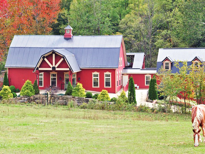 The iconic red exterior of The Barn Inn stands proudly against Ohio's countryside, like a beacon of comfort calling weary travelers home.