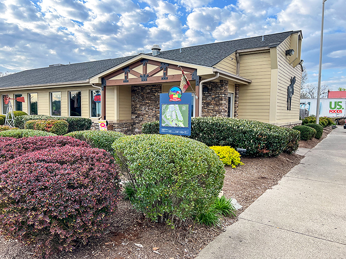 The welcoming fa&ccedil;ade of Moose Cafe in Asheville, where the landscaping is as thoughtfully prepared as the comfort food waiting inside.