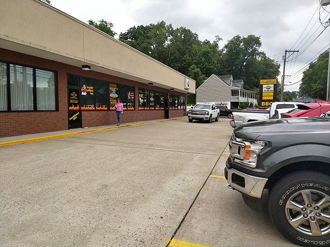 The unassuming storefront with its flame-decorated windows is like a beacon to barbecue pilgrims. Smoke signals that say "come hungry, leave happy."